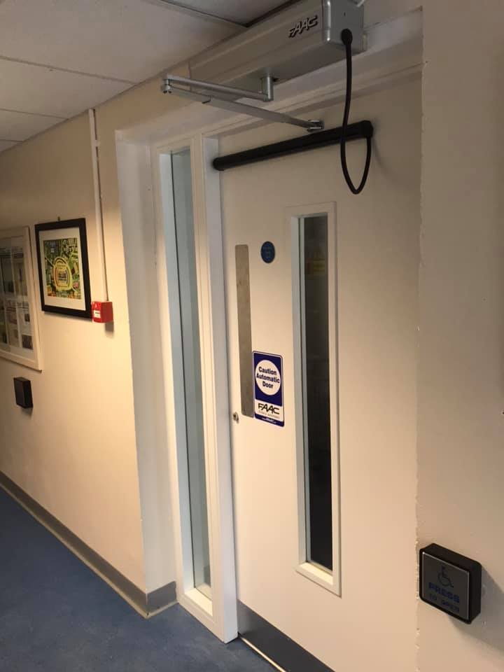 A FAAC Automatic Swinging Door Installed In Trinity College. – Roller Doors